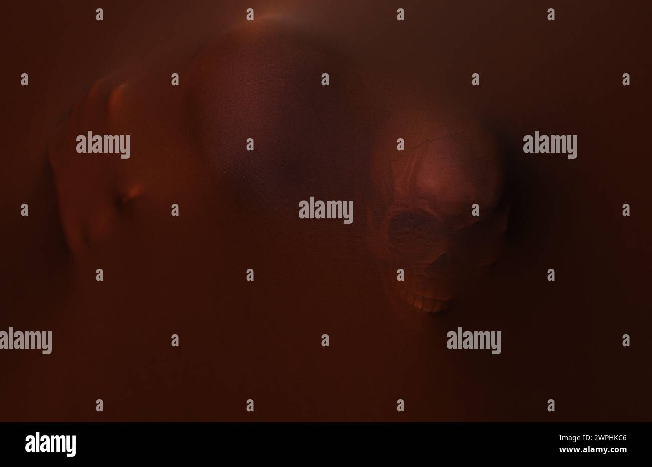 Silhouette of creepy ghost with skulls behind brown cloth Stock Photo ...