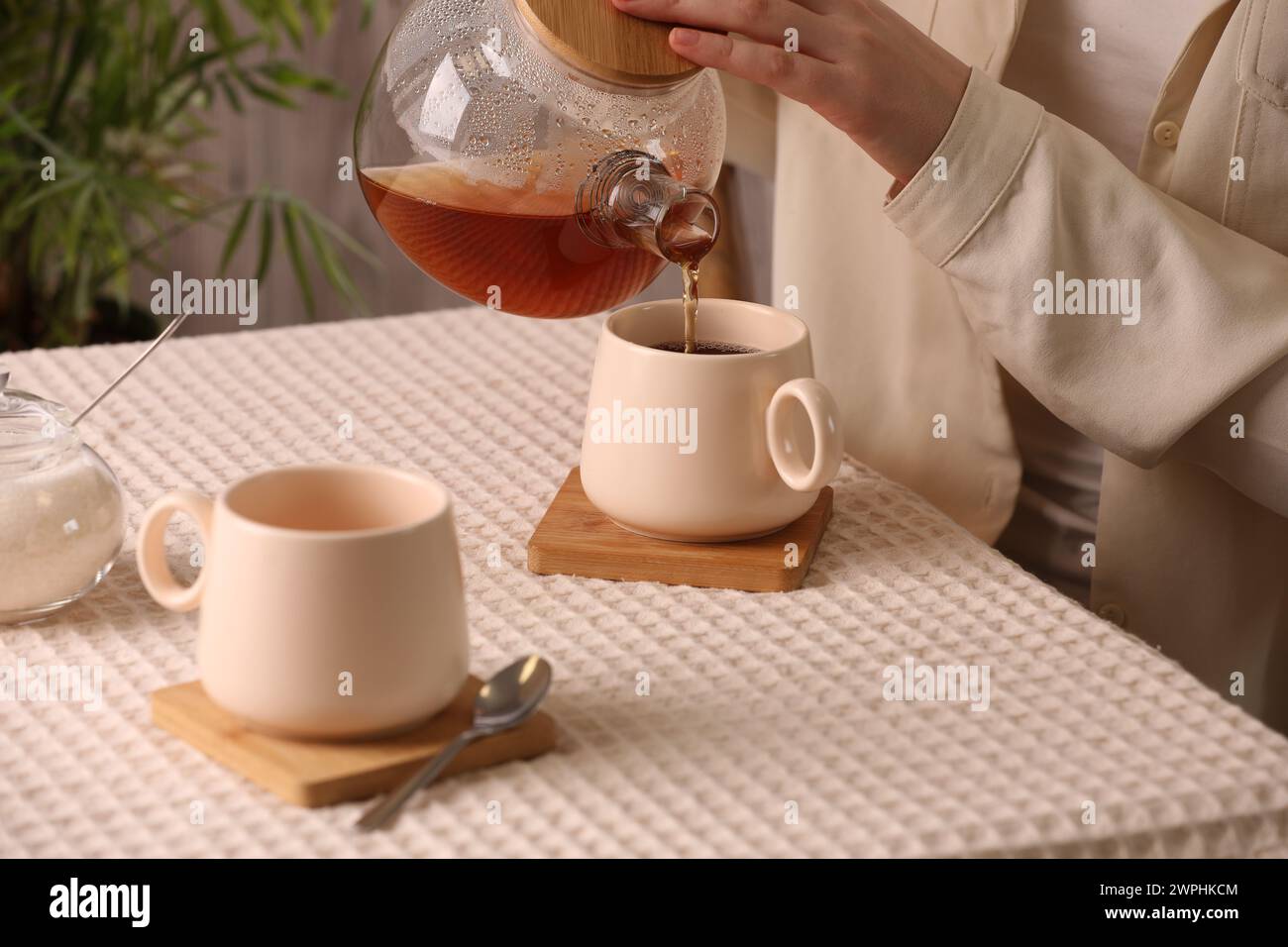 Woman pouring aromatic tea cup hi-res stock photography and images - Alamy