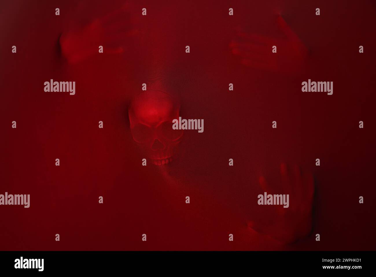 Silhouette of creepy ghost with skull behind red cloth Stock Photo - Alamy