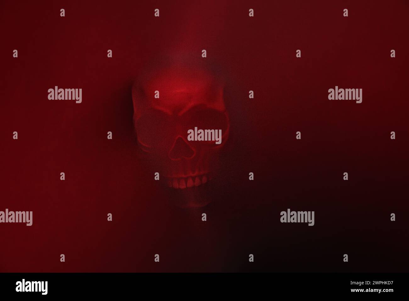 Silhouette of creepy ghost with skull behind red cloth Stock Photo - Alamy