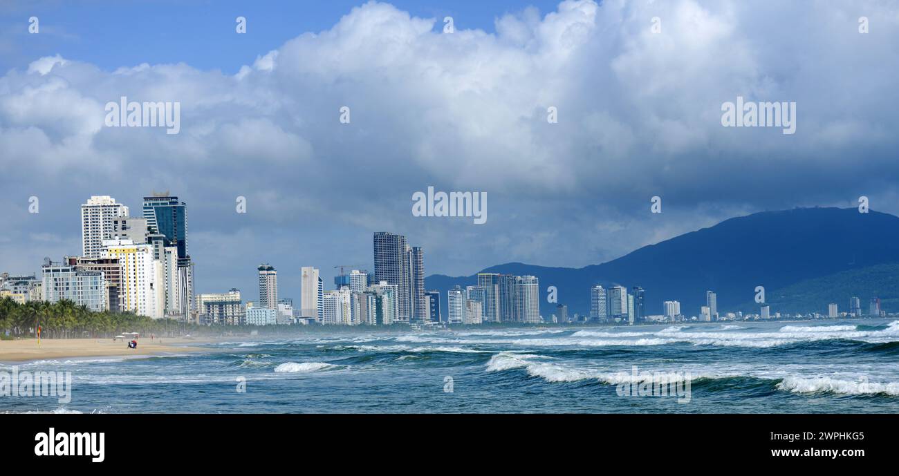 The beautiful long white sand beach along the changing waterfront ...