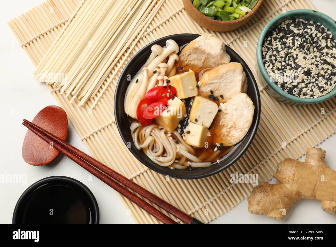 Delicious ramen served on white table, flat lay. Noodle soup Stock ...