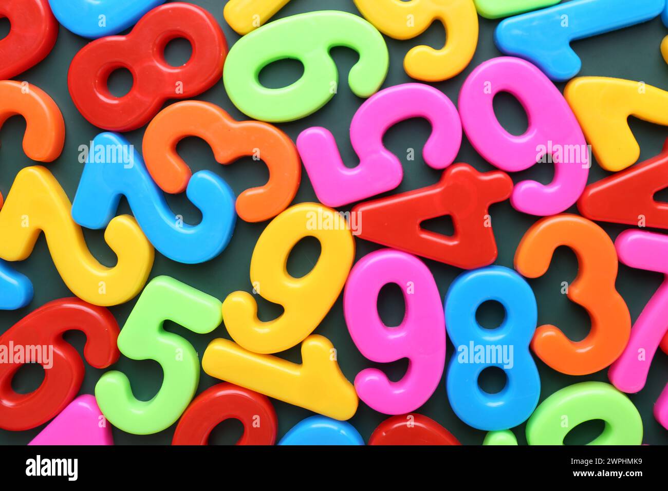 Colorful numbers on green background, top view Stock Photo - Alamy