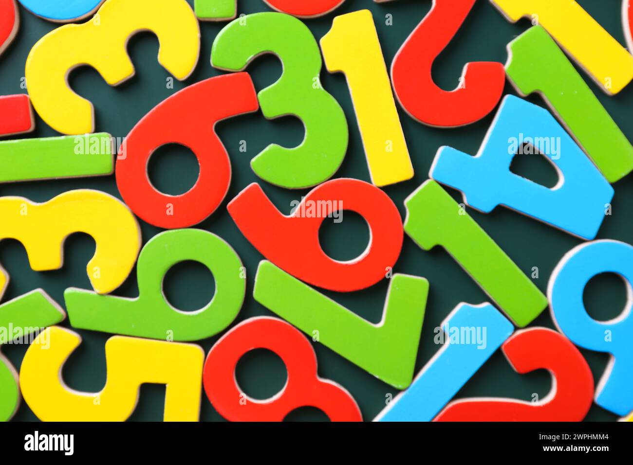 Colorful numbers on green background, top view Stock Photo - Alamy