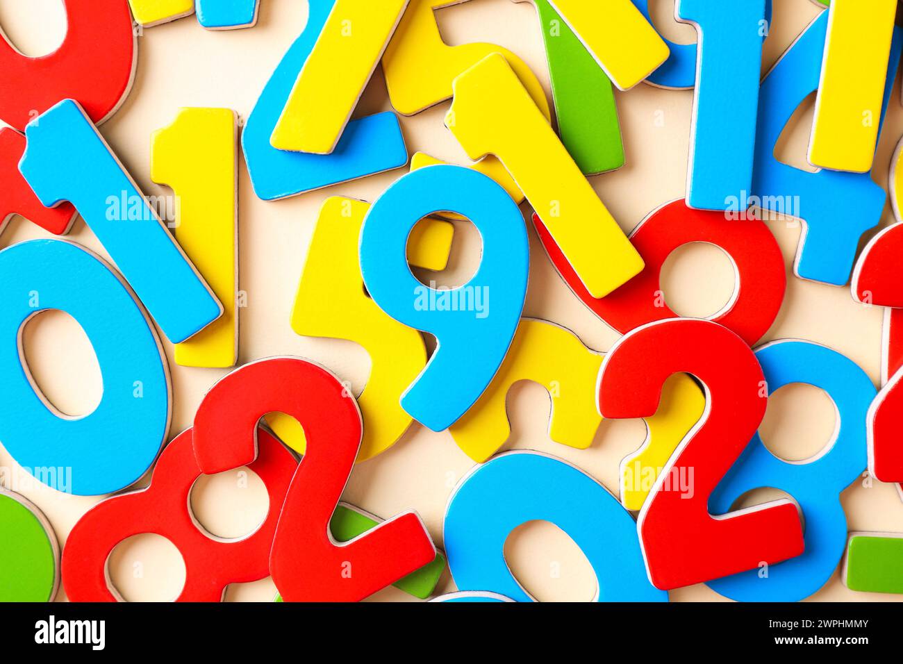 Colorful numbers on beige background, flat lay Stock Photo - Alamy