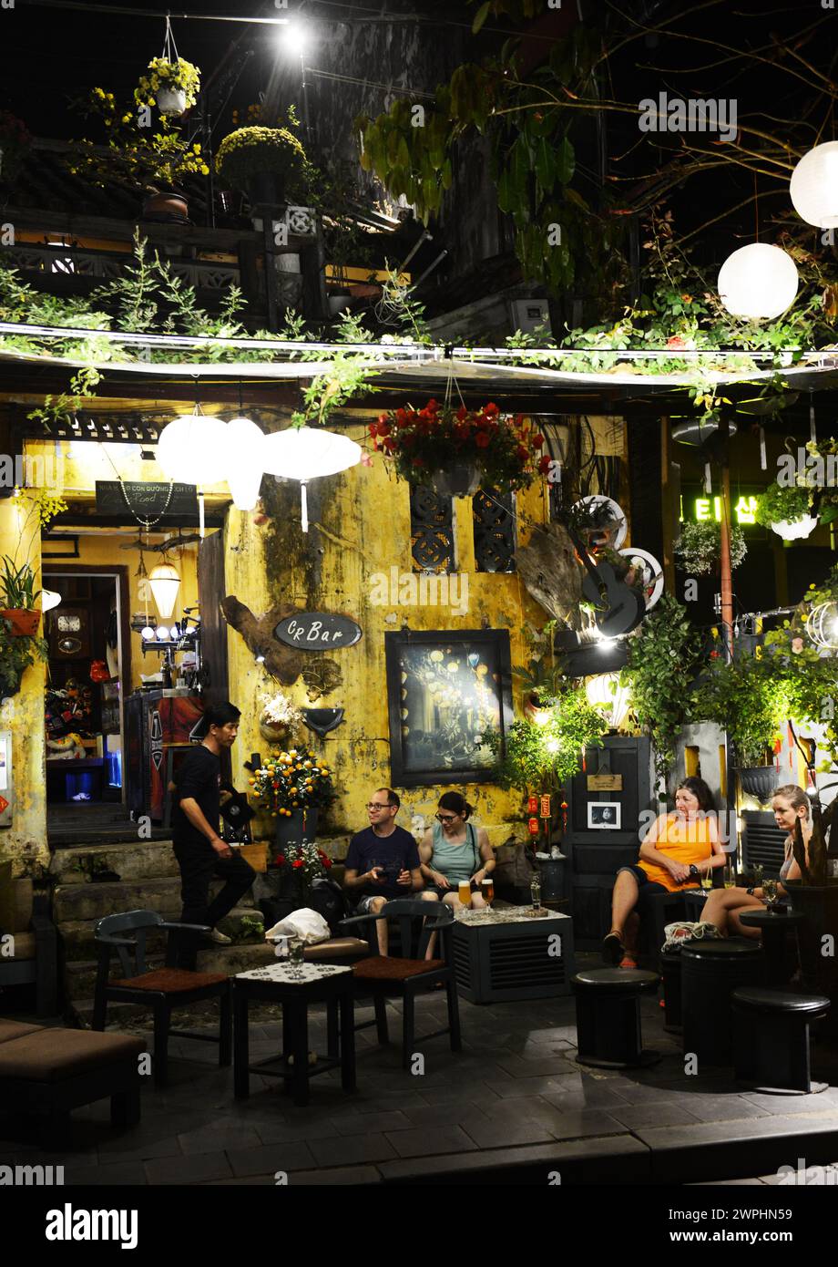 The vibrant Cyclo's Road Cafe at night. Old city of Hoi An, VIetnam ...