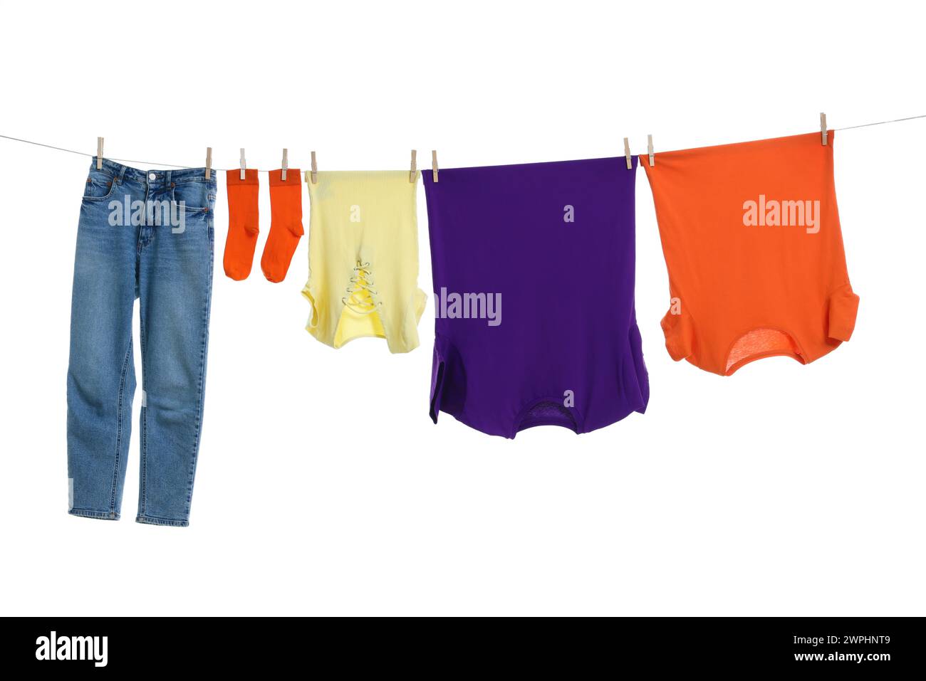 Different clothes drying on laundry line against white background Stock ...