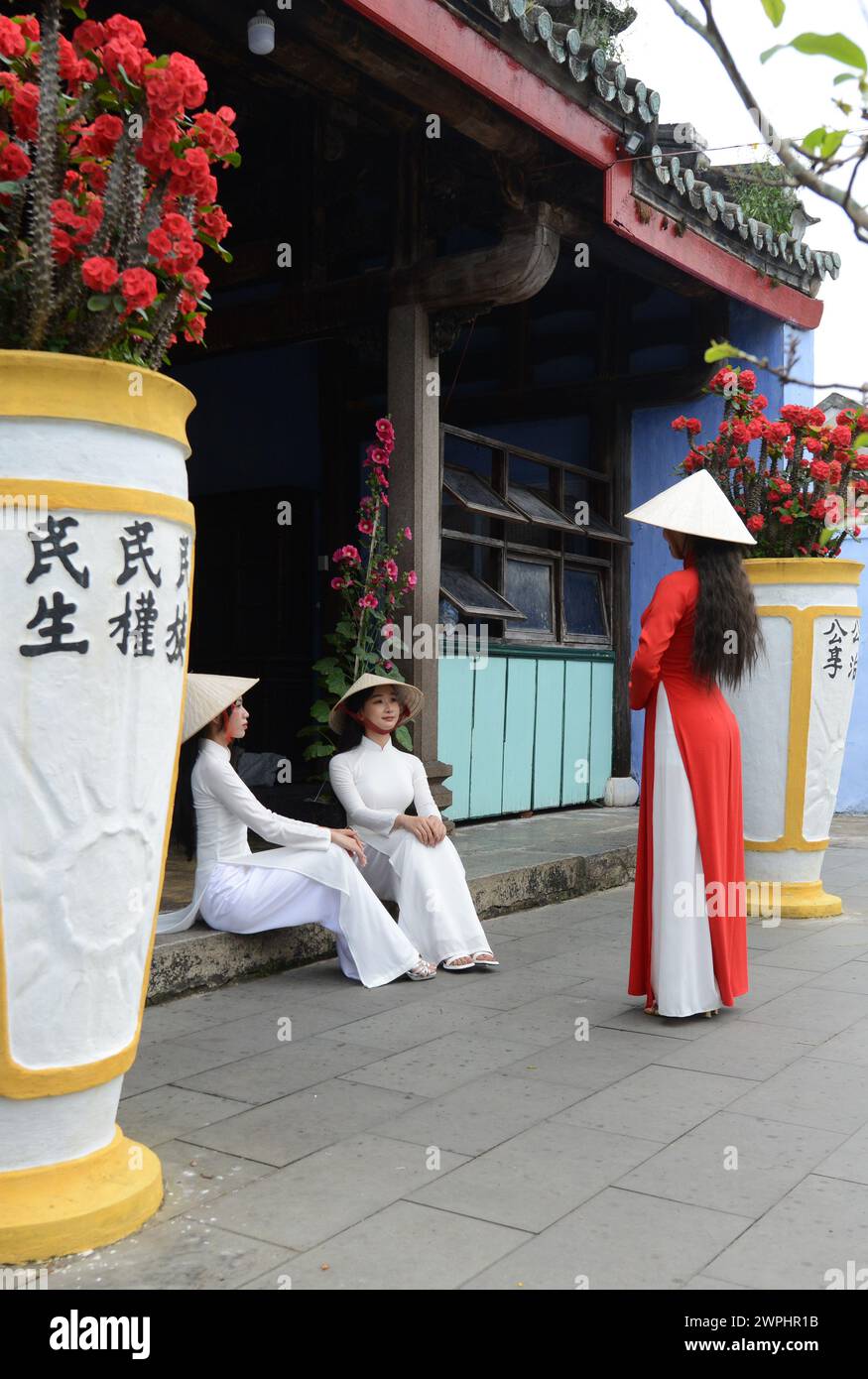 Vietnamese models in a shoot at the Hoa Van Le Nghia Buddhist temple in the old town of Hoi An ...