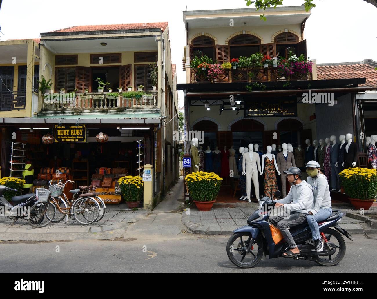 Old buildings and daily life scenes in the old city of Hoi An, Vietnam ...