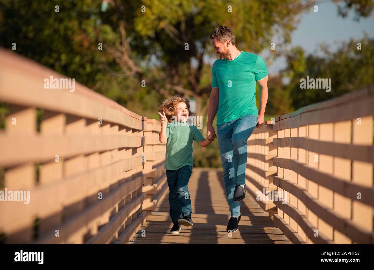 Dad and child playing together outdoors. Happy and enjoy Father and Son ...
