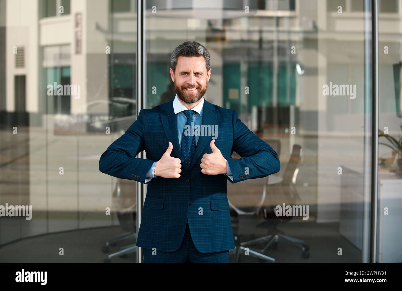 Businessman going thumbs up. Business man showing OK sign with his ...