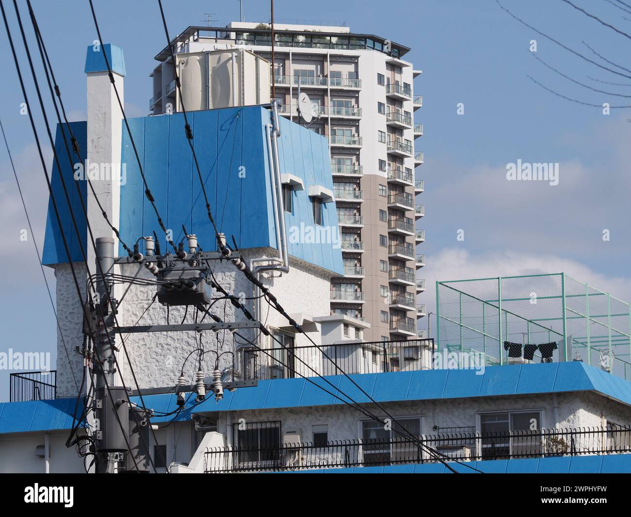 TOKYO, JAPAN - March 7, 2024: Utility pole and power lines in Tokyo's ...