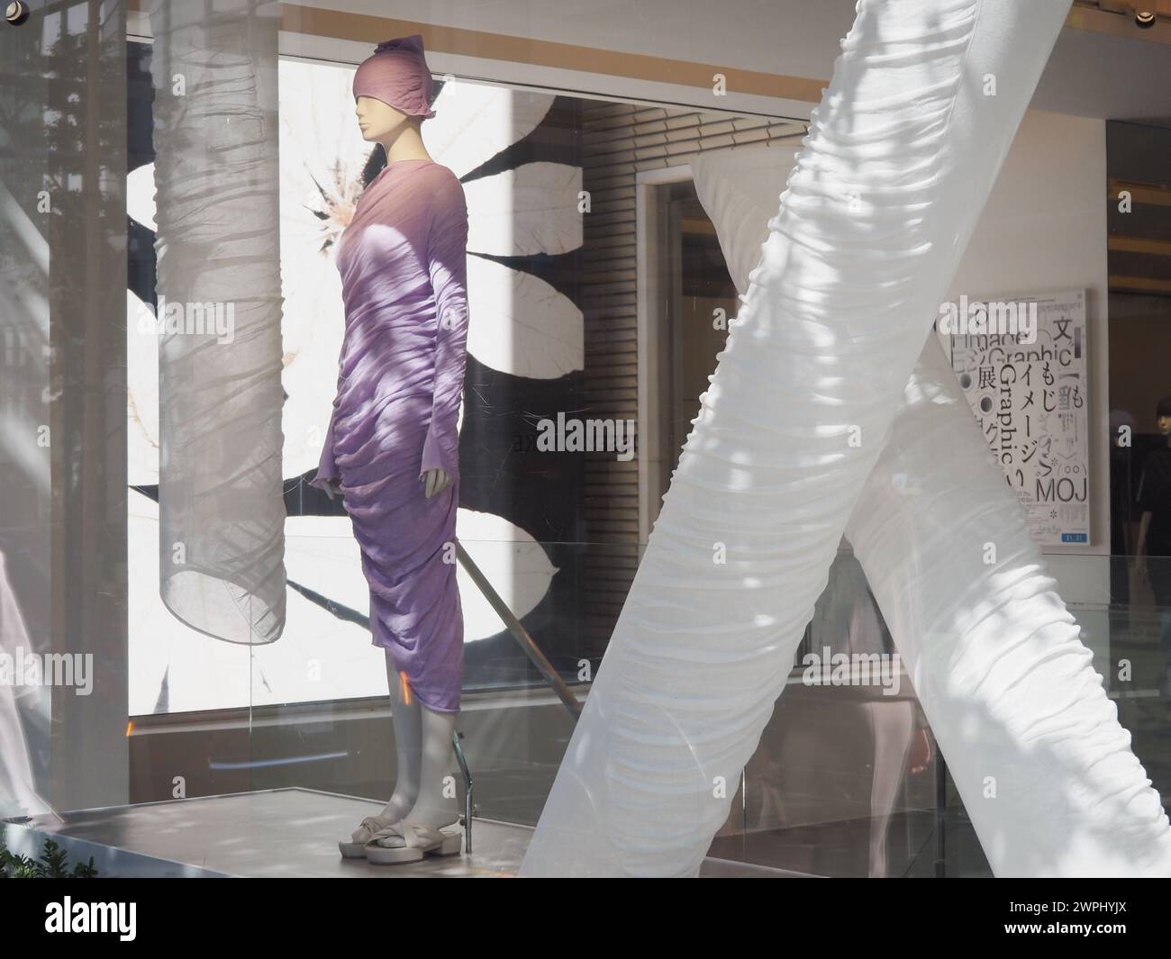 TOKYO, JAPAN - March 3, 2024: Display in the window of an Issey Miyake ...