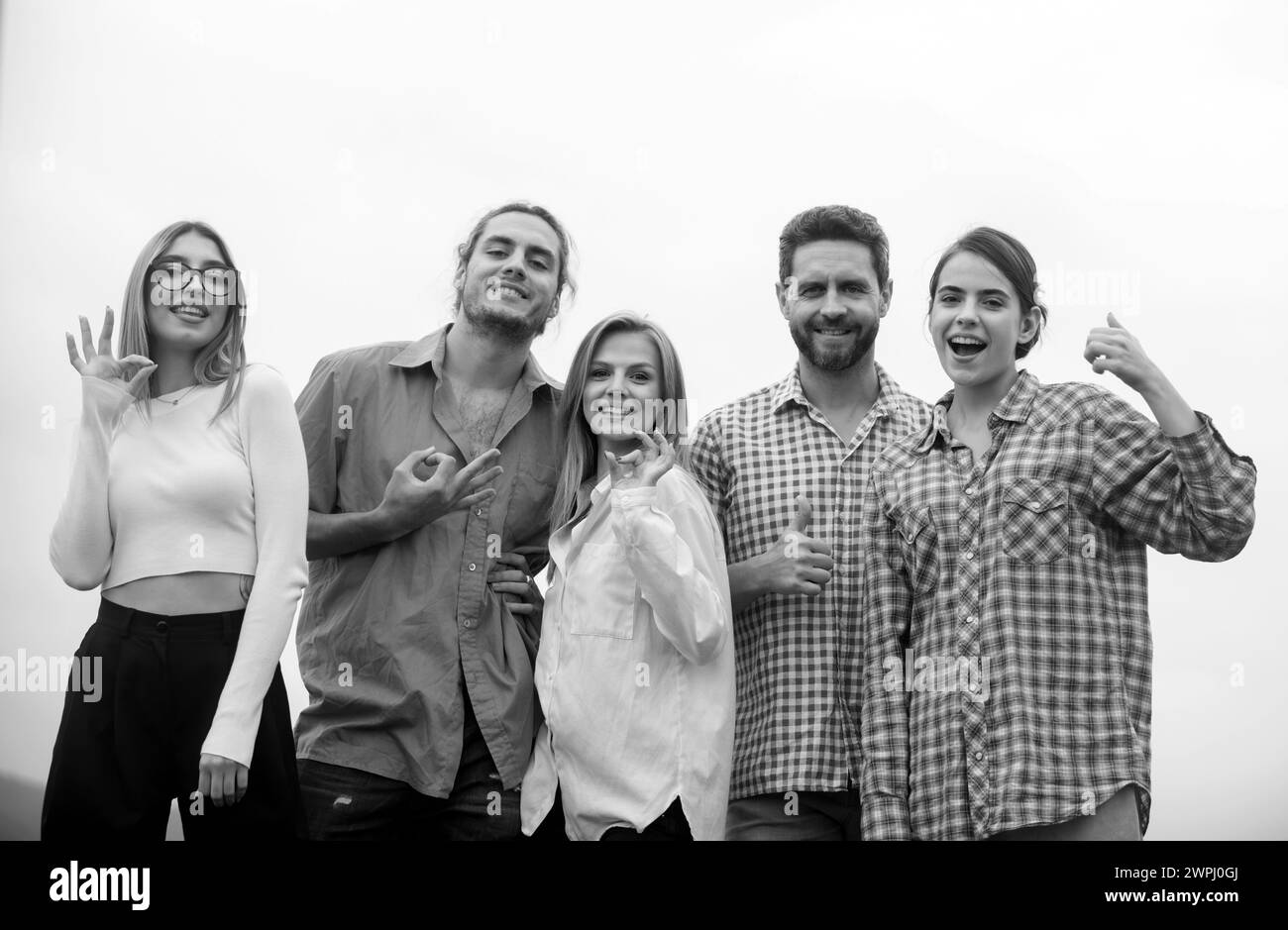 Smiling group of friends laughing with thumb up. Company students best ...