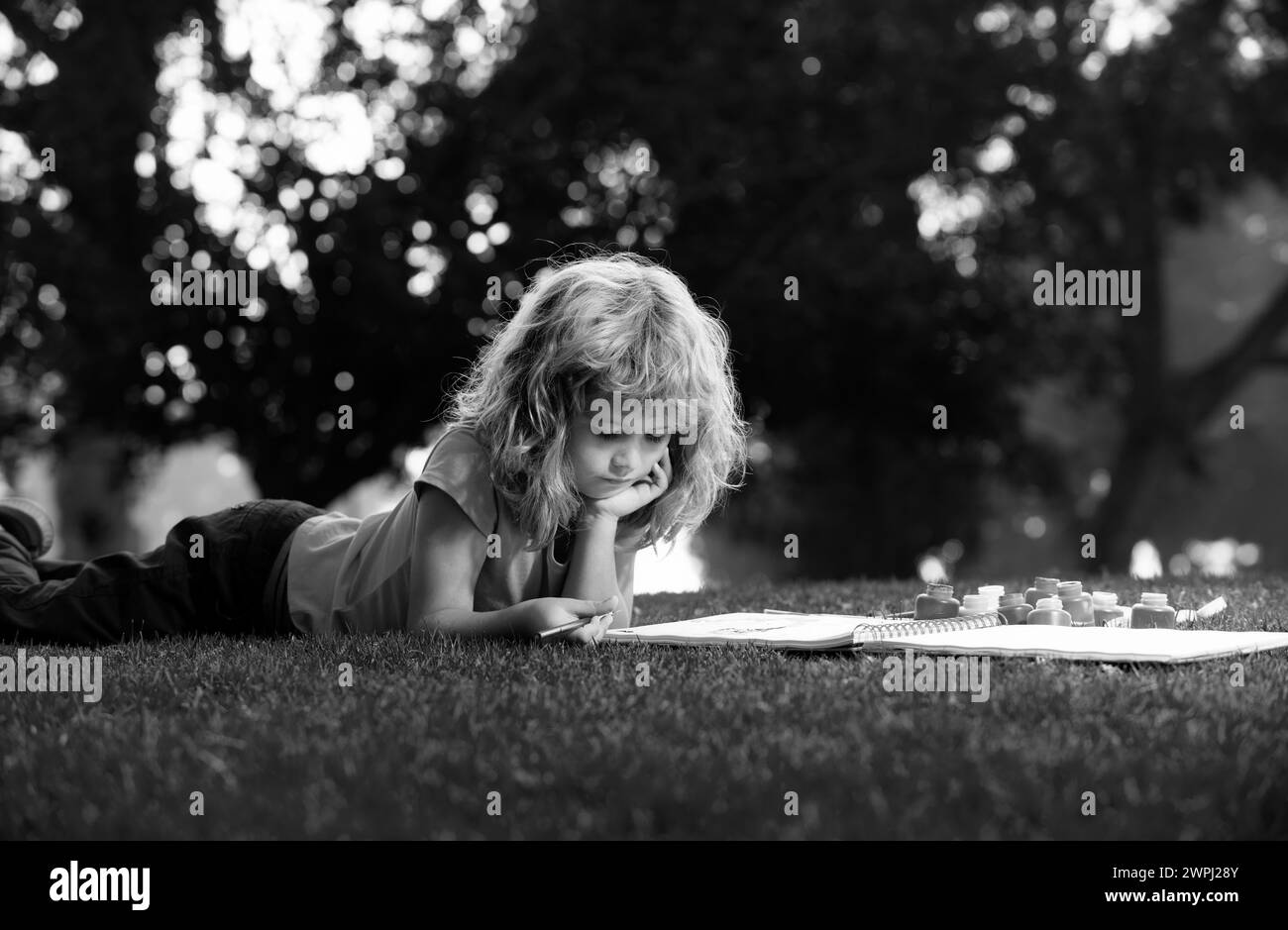 Child drawing. Portrait of smiling happy kid enjoying art and craft ...