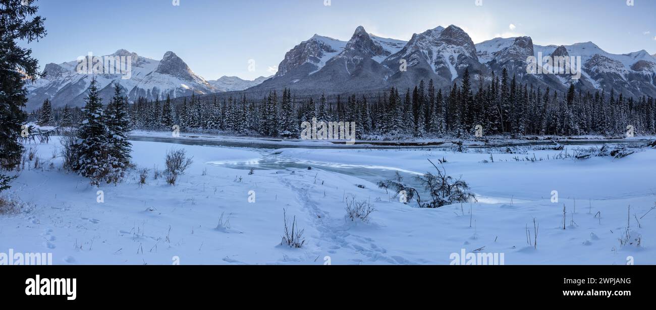 Scenic Frozen Bow River Panoramic Landscape Snow Covered Mountain Peaks Cold Winter Day. Canmore ...