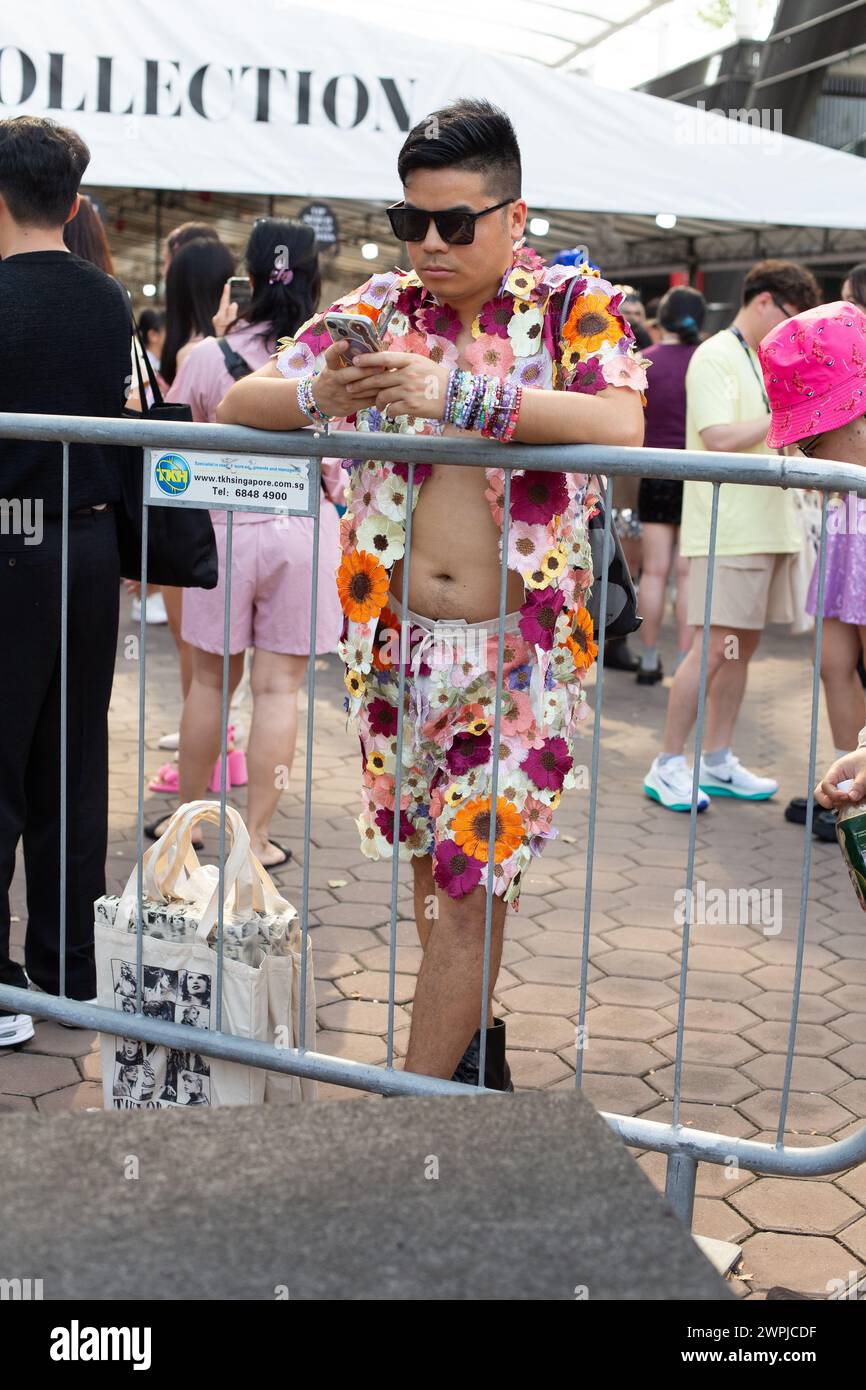 7 March 2024. A male fan dress in flowery shirt and shorts at Taylor ...