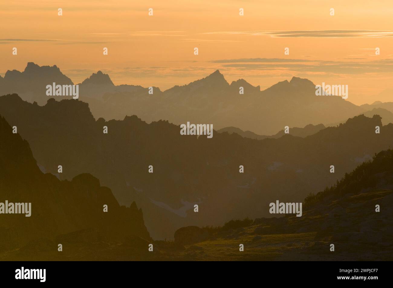 Sunset over the ridges of the cascade Range Alpine Lakes Wilderness in ...