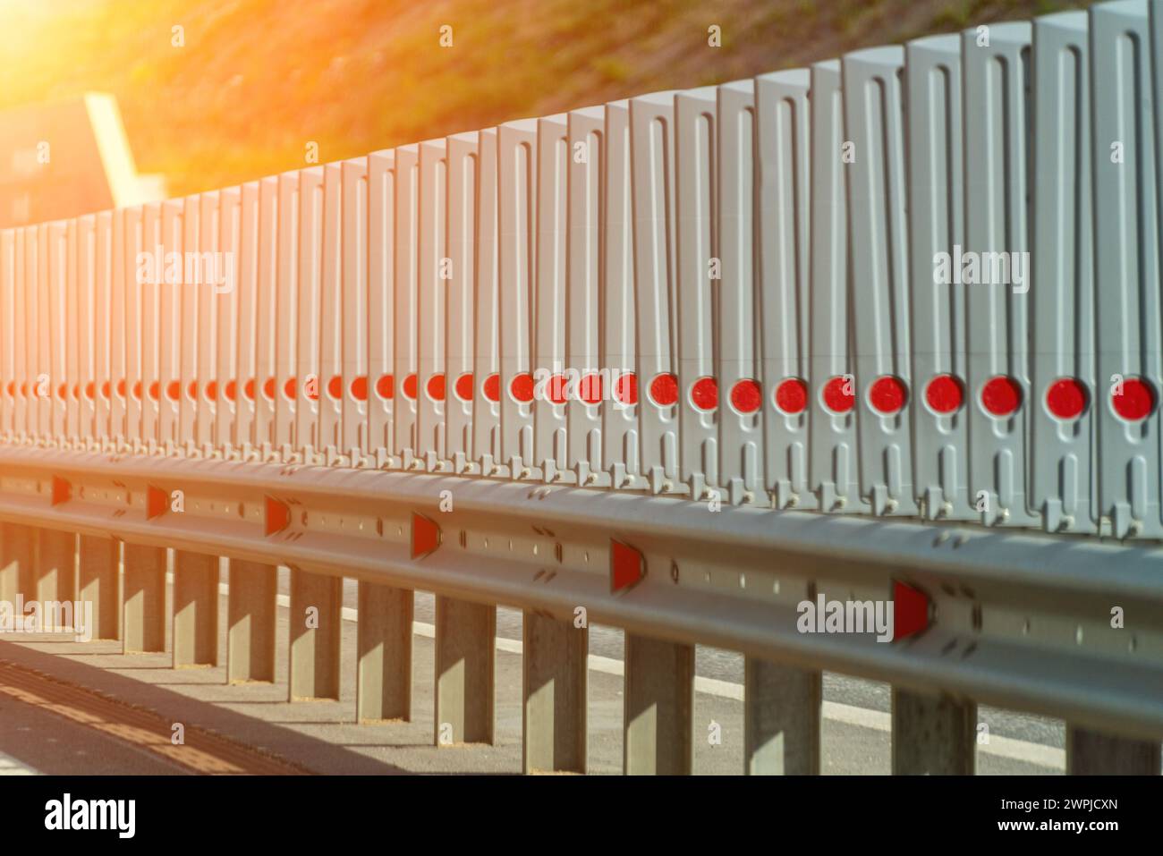 Safety barriers on highway. Anodized safety steel barrier. Enhancing ...