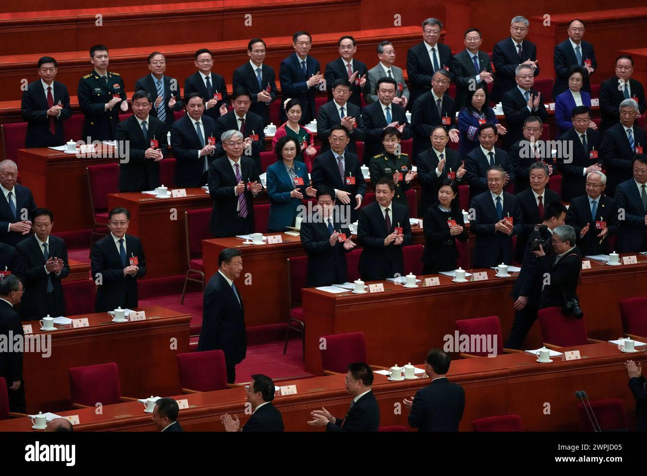 Delegates applaud as Chinese President Xi Jinping and Premier Li Qiang ...