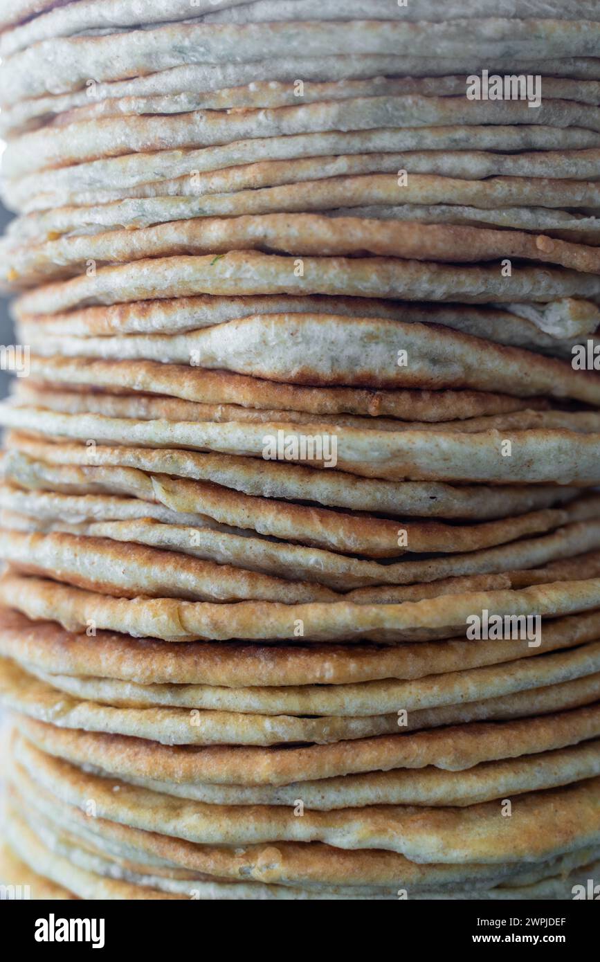 Flatbread lavash, chapati, naan, heap of tortilla on a blue background ...