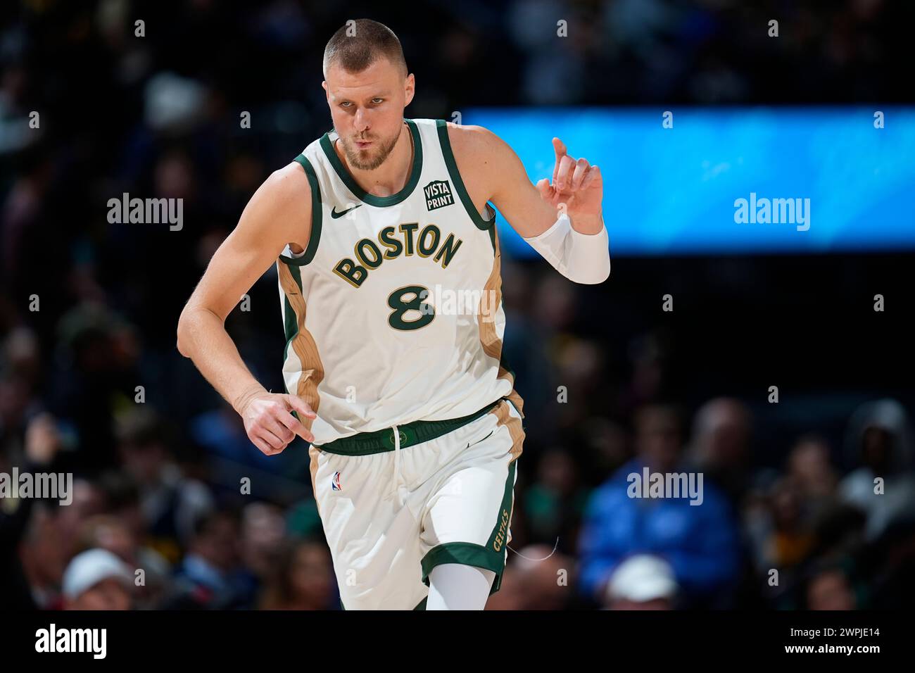 Boston Celtics center Kristaps Porzingis gestures after hitting a 3 ...