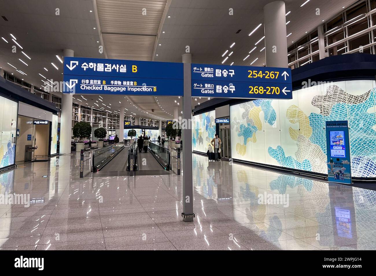 Incheon, South Korea. 30th Nov, 2023. Passengers walk through an ...