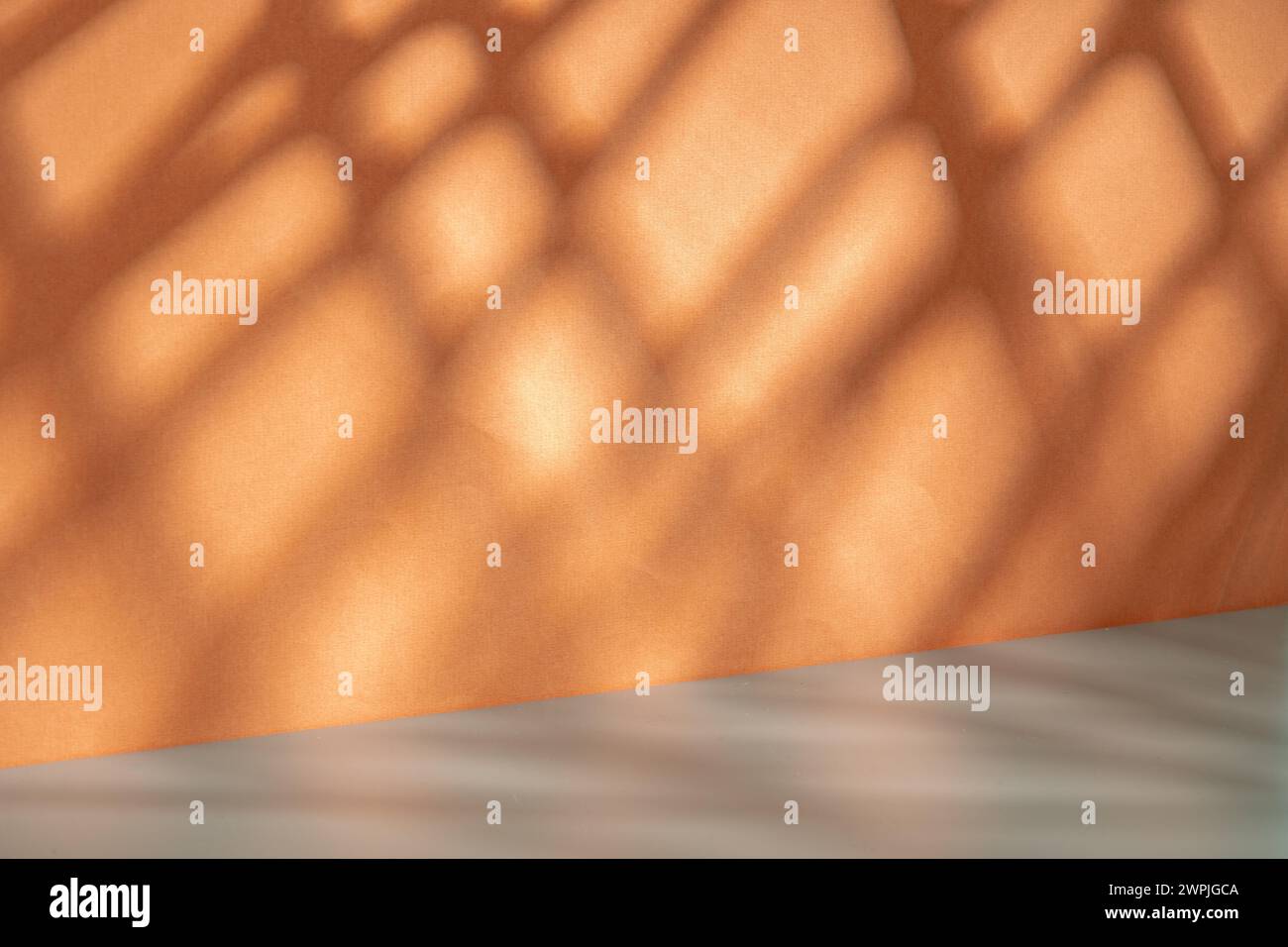 Wall with shadow pattern for product presentation Stock Photo - Alamy