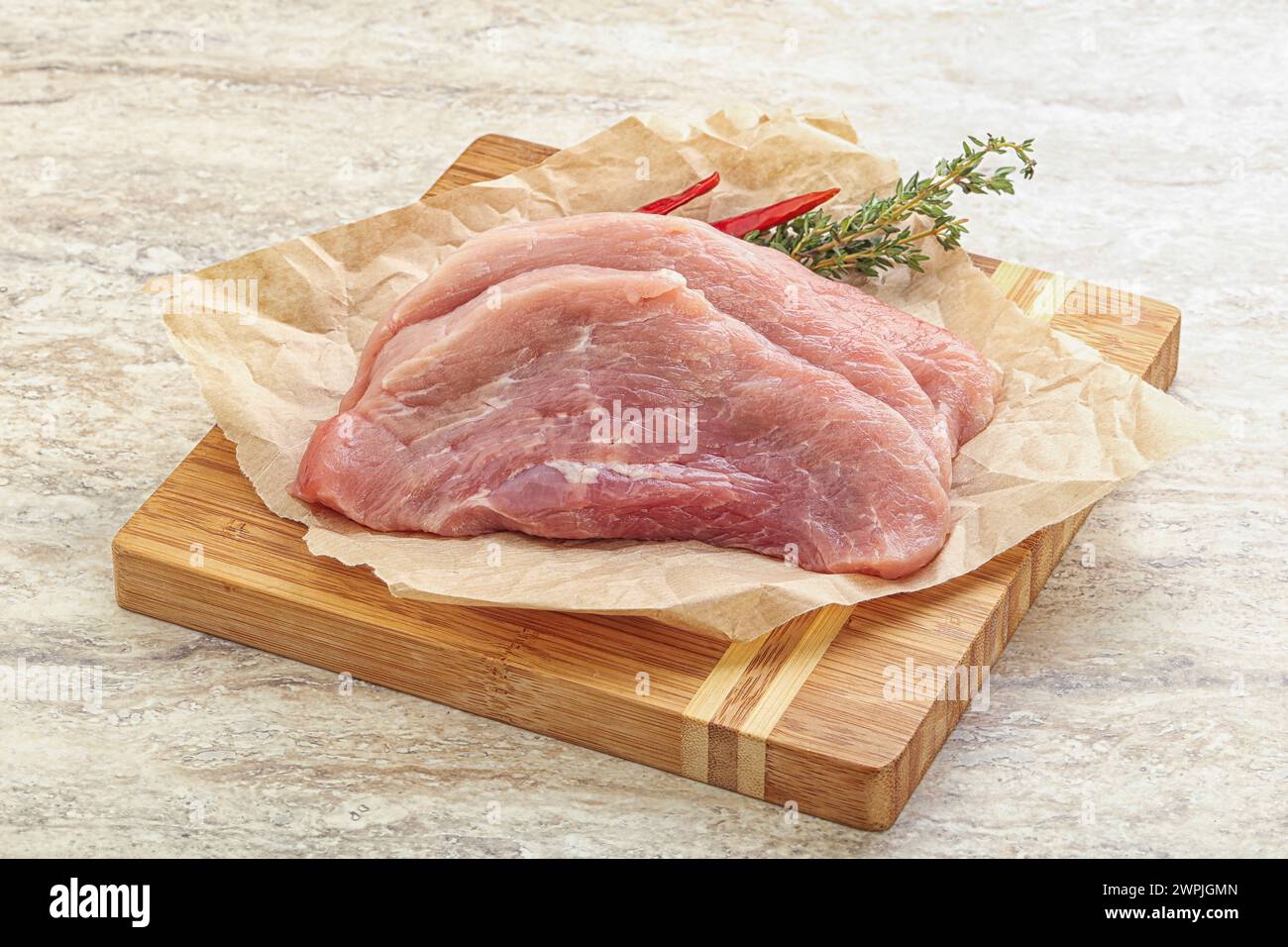 Raw pork schnitzel cut for roast Stock Photo - Alamy