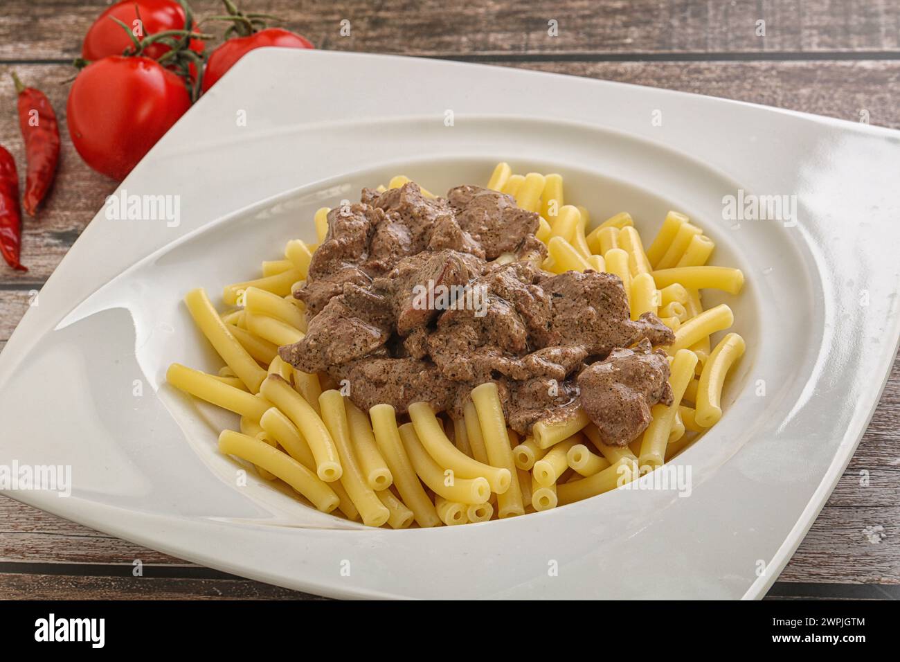 Creamy chicken liver with pasta macaroni Stock Photo - Alamy