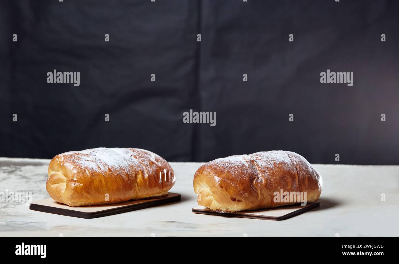 Homemade buns with jam with powdered sugar on wooden background. Fresh ...