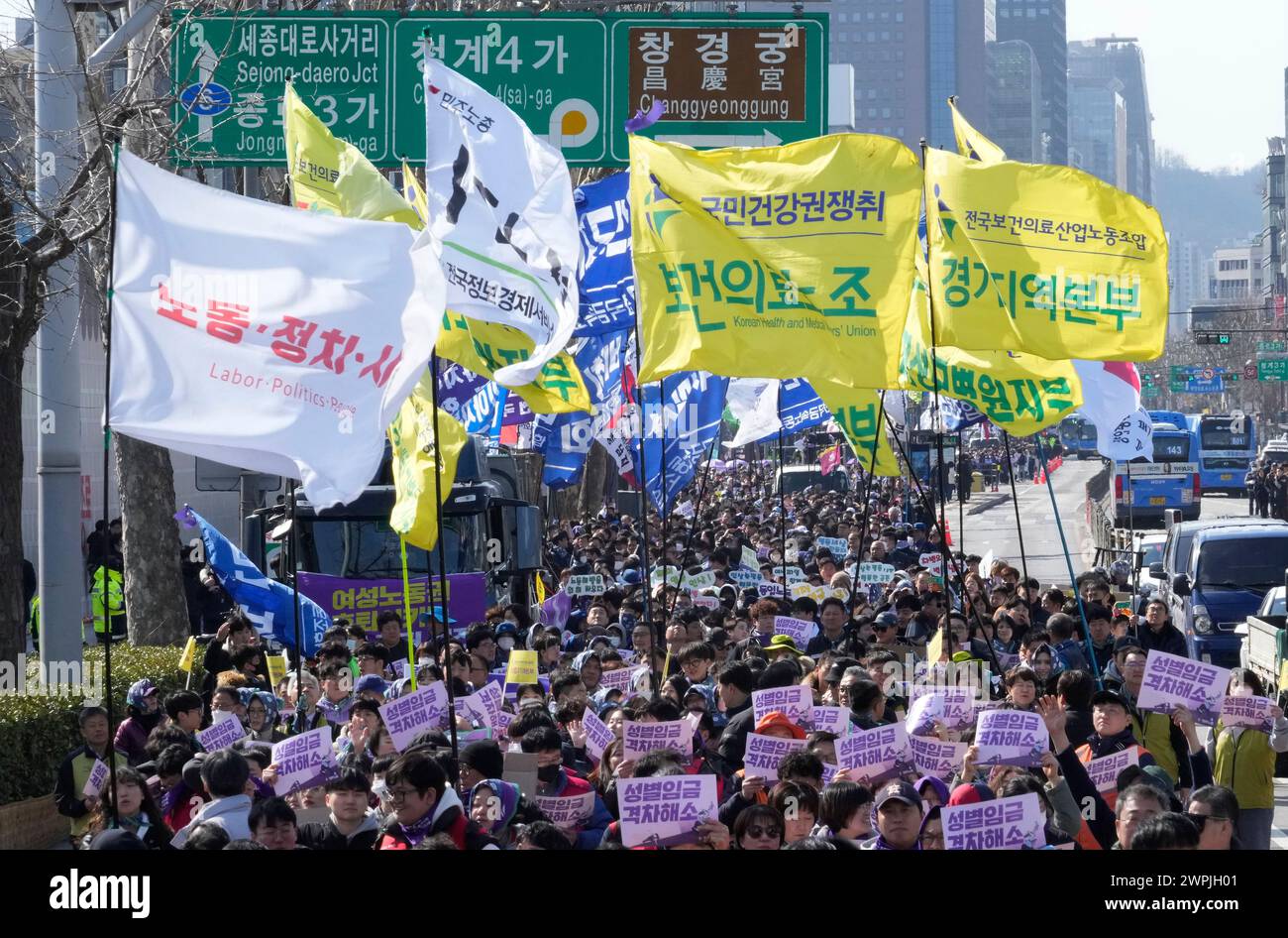 Members of the Korean Confederation of Trade Unions march during a ...