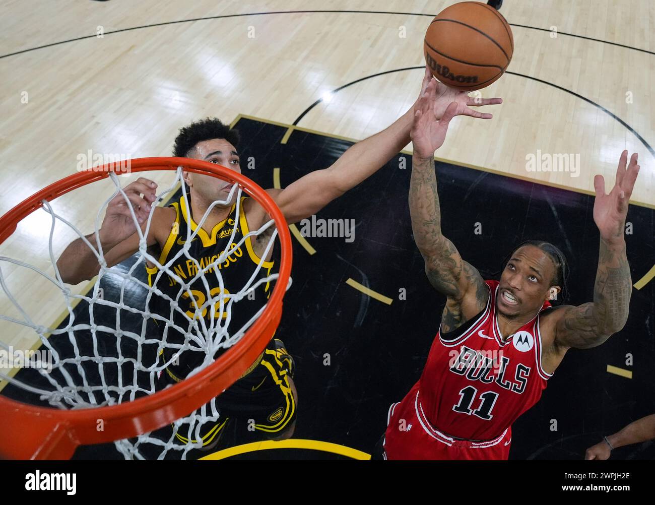 Golden State Warriors center Trayce Jackson-Davis, left, and Chicago ...
