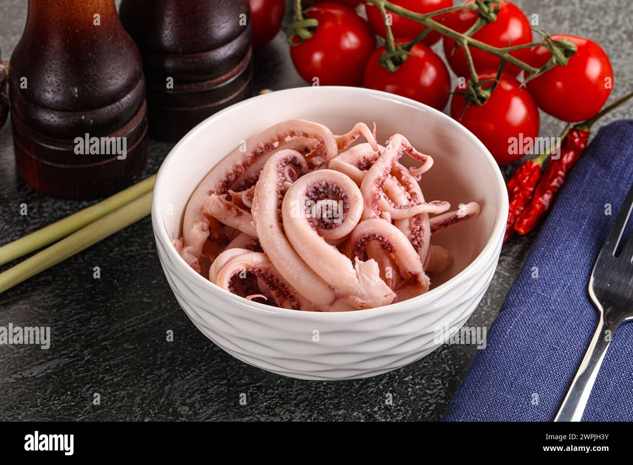 Delicous marinated squid tentacles snack in the bowl Stock Photo - Alamy