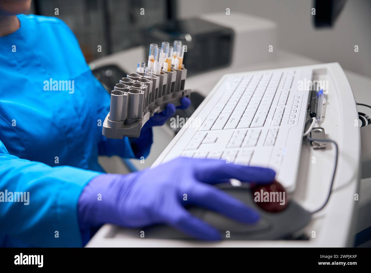 Laboratory employee uses modern equipment to analyze biomaterial Stock ...