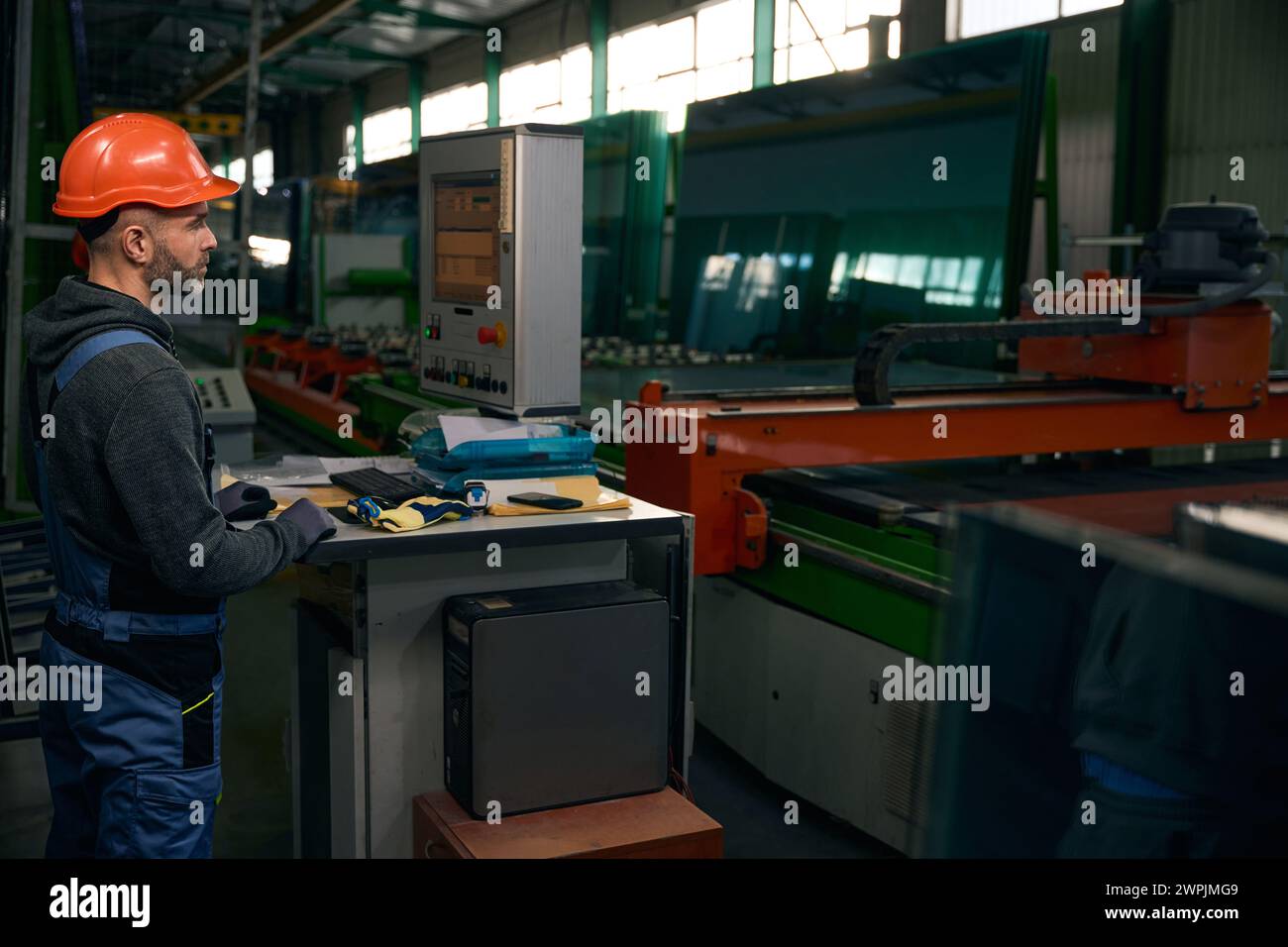 Window production employee in the workshop at the workplace Stock Photo ...