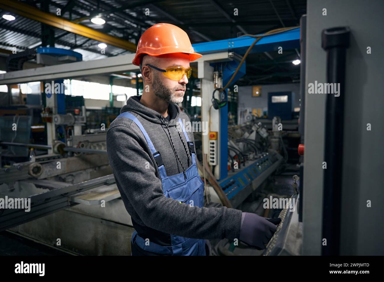 Master in a window production works on high-tech equipment Stock Photo ...