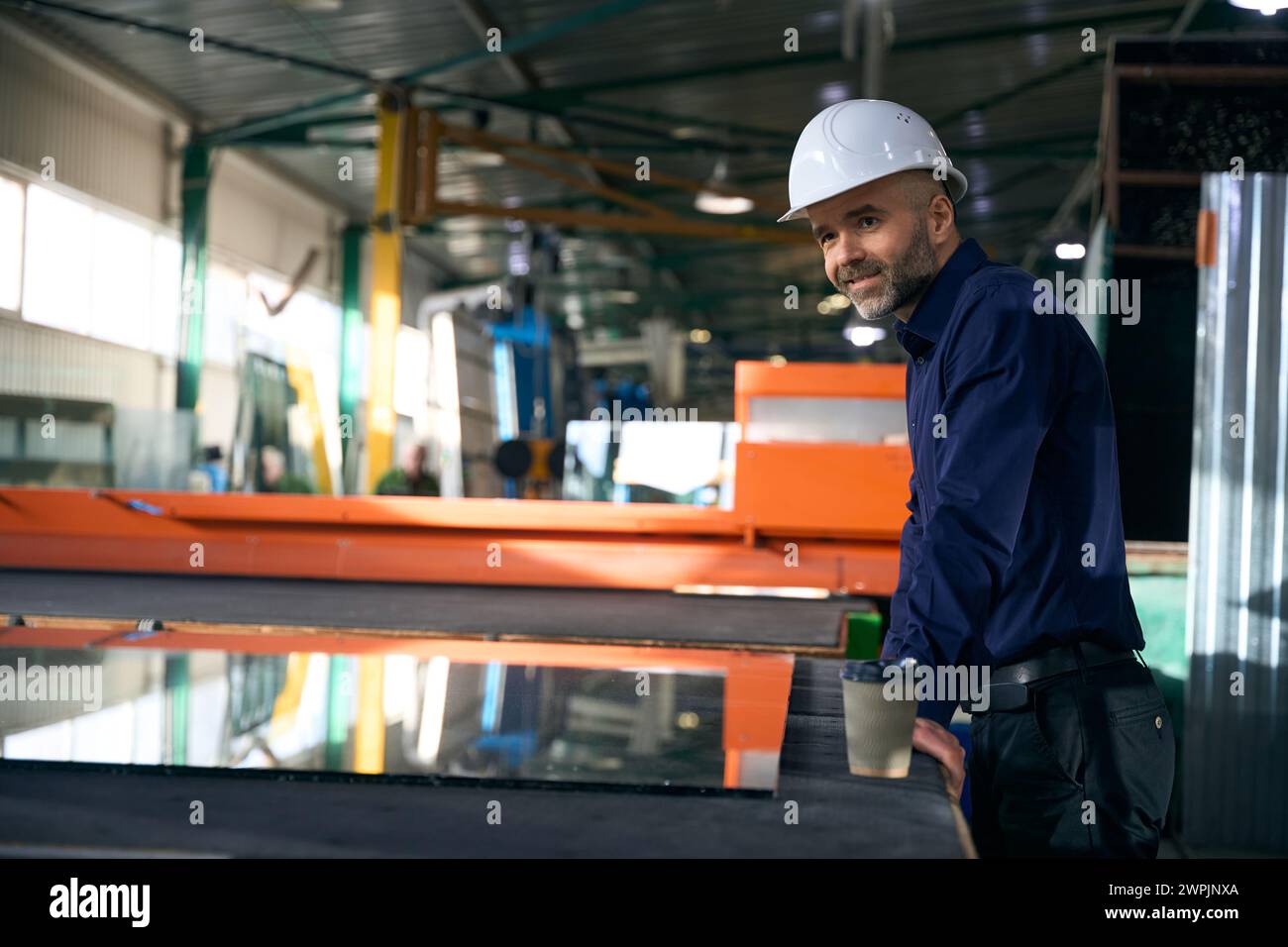 Man at a workplace in window production Stock Photo - Alamy