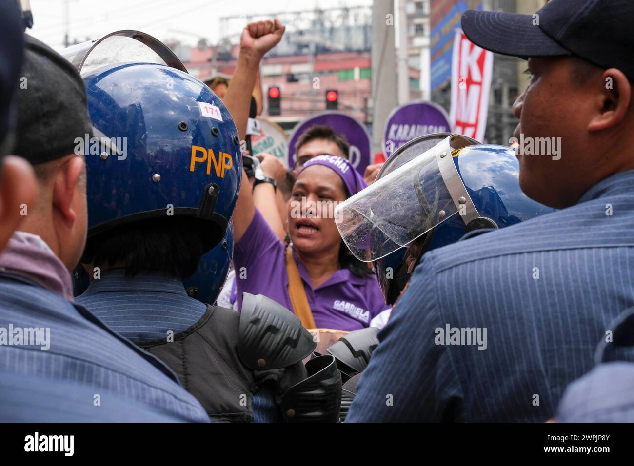 Womens groups scuffle with police while protesting on International ...