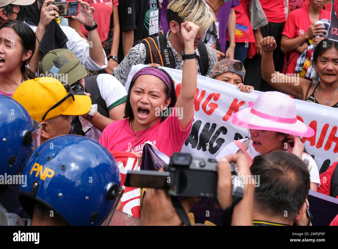 Womens groups scuffle with police while protesting on International ...