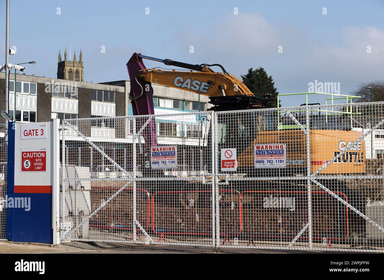 Tracked excavator behind security fencing hi-res stock photography and ...
