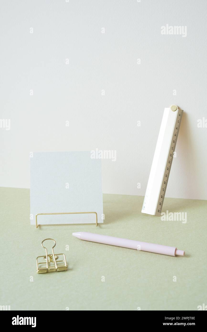 Blank memopad with gold metallic holder, ruler, pen, clip on desk ...
