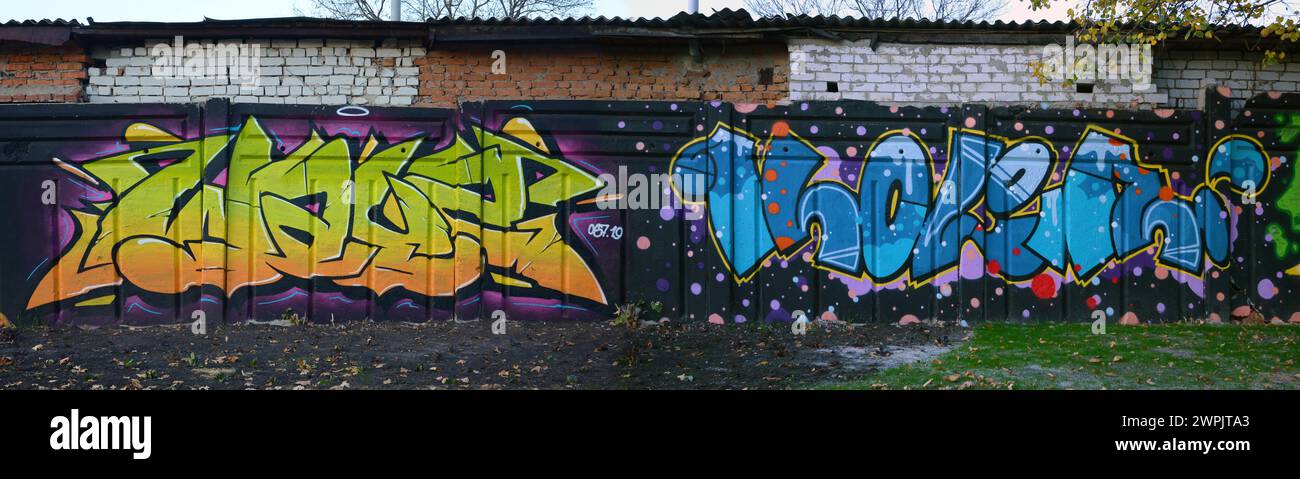 The old wall decorated with paint stains in the style of street art ...