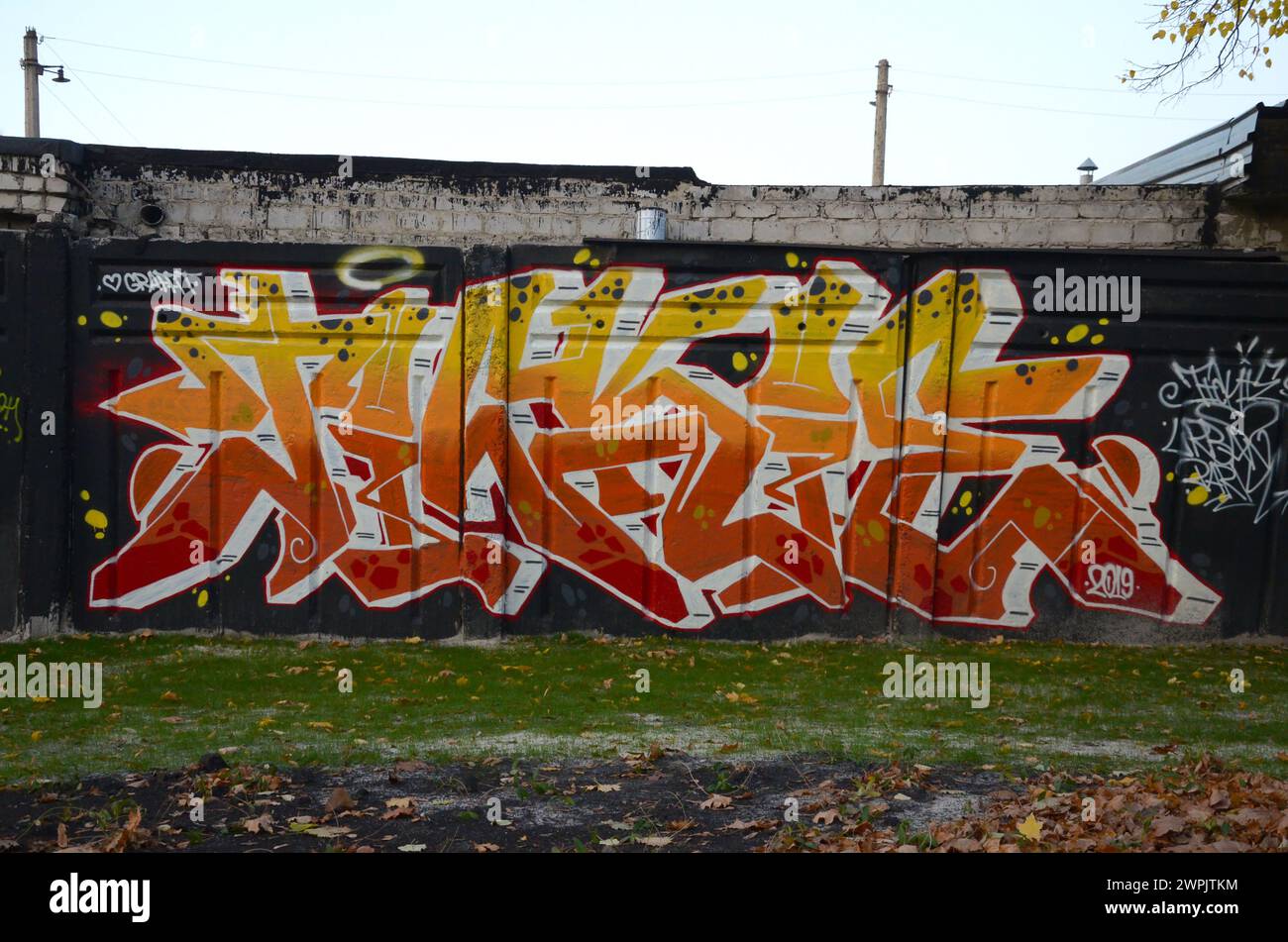 The old wall decorated with paint stains in the style of street art ...