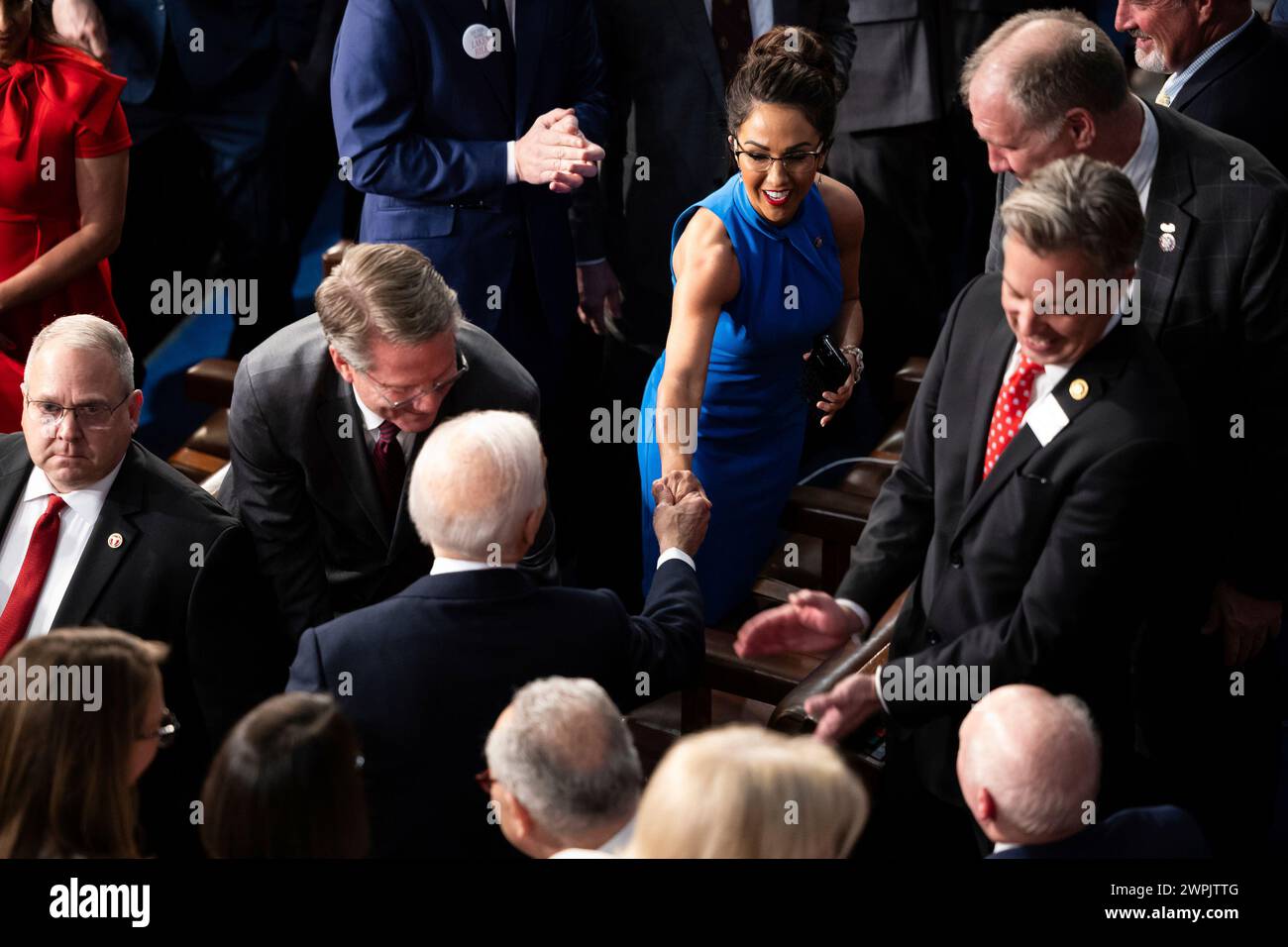 President Joe Biden shakes hands with Rep. Lauren Boebert (R-Colo.) as ...