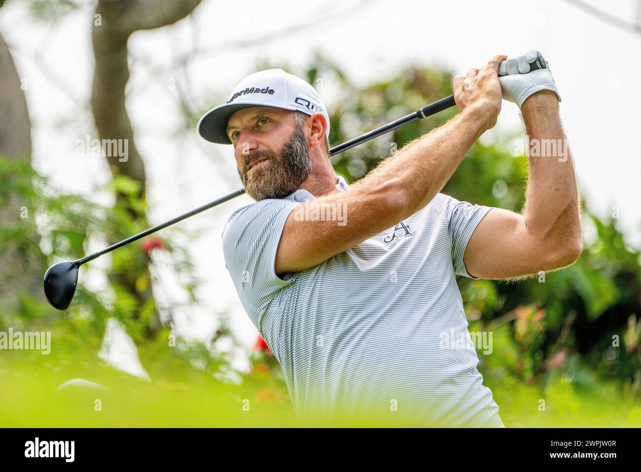 Captain Dustin Johnson of 4Aces GC hits his shot from the tenth tee ...