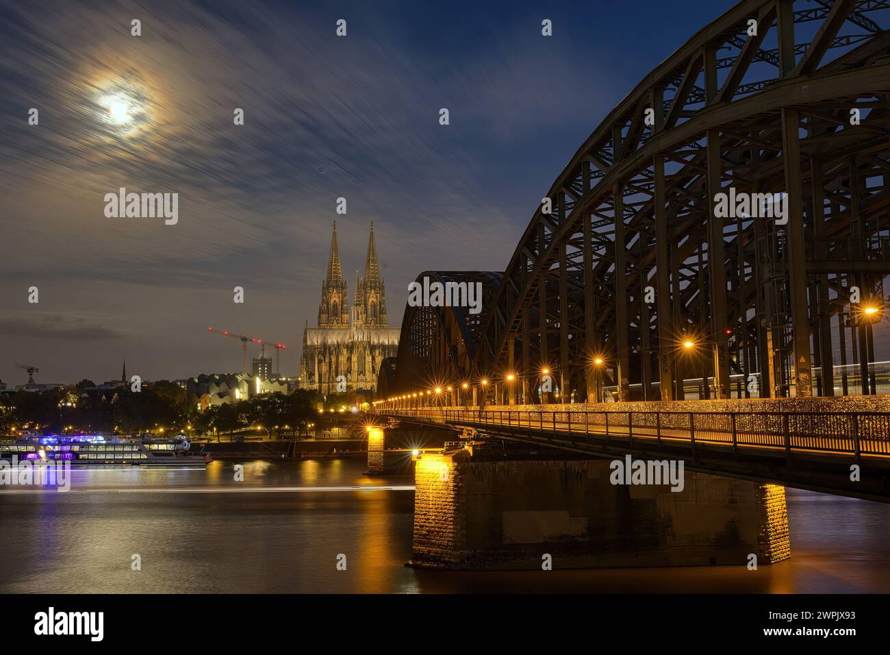 A scenic view of the Cologne cathedral with the full moon Stock Photo ...