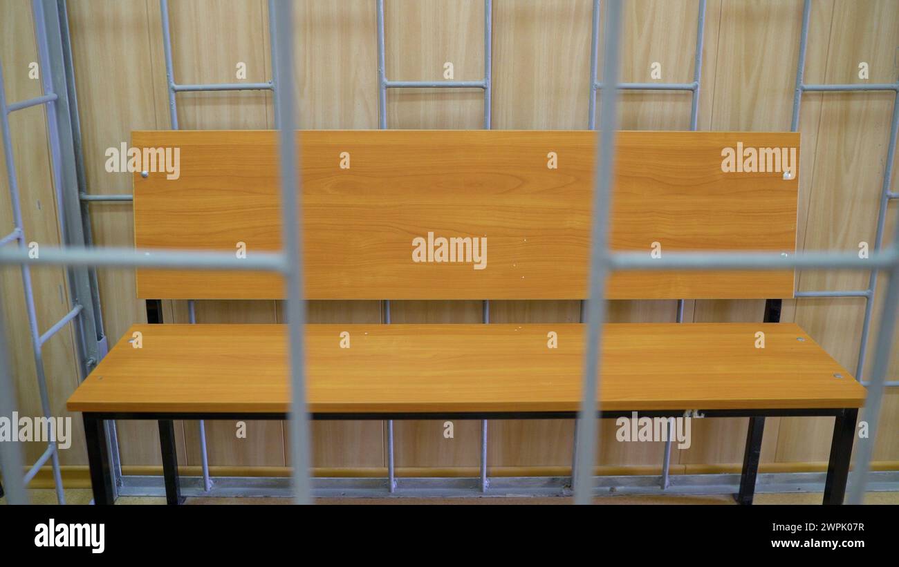Courtroom interior, close-up. Bench for the accused in the courthouse ...