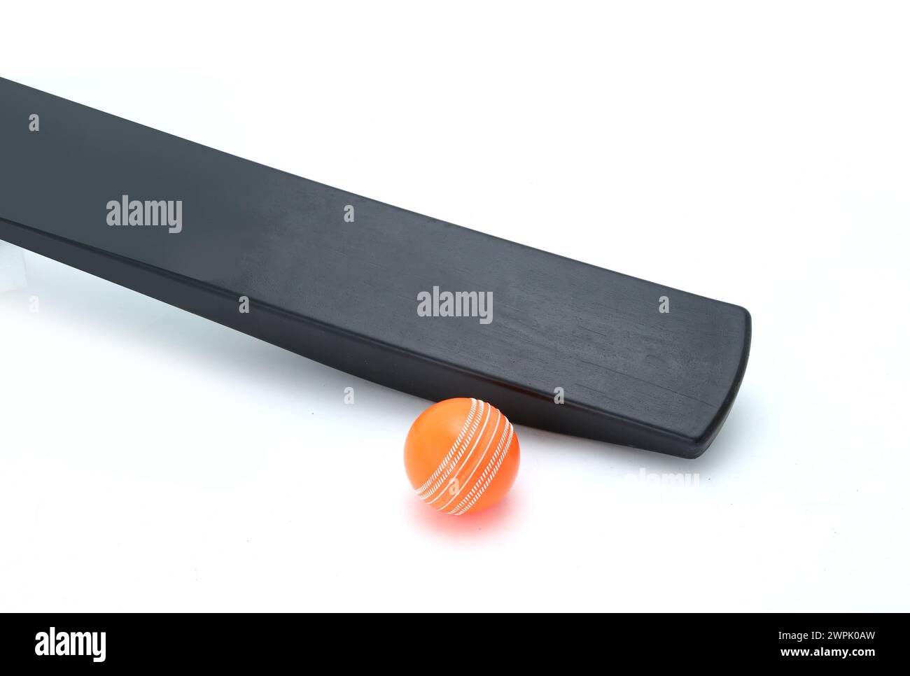wind ball with black pvc cricket bat isolated Stock Photo - Alamy