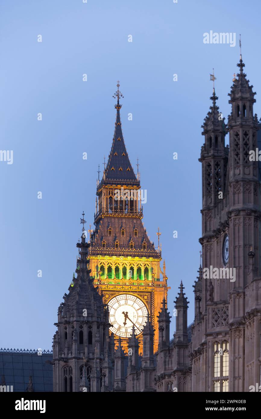 UK, London, close up detail of the houses of Parliament and the illuminated Big Ben's clock ...